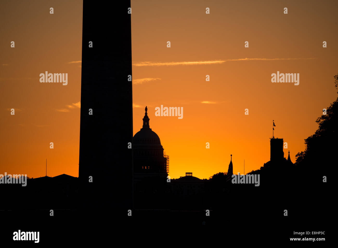 WASHINGTON DC, USA - The rising sun silhouettes some of Washington DC's ...