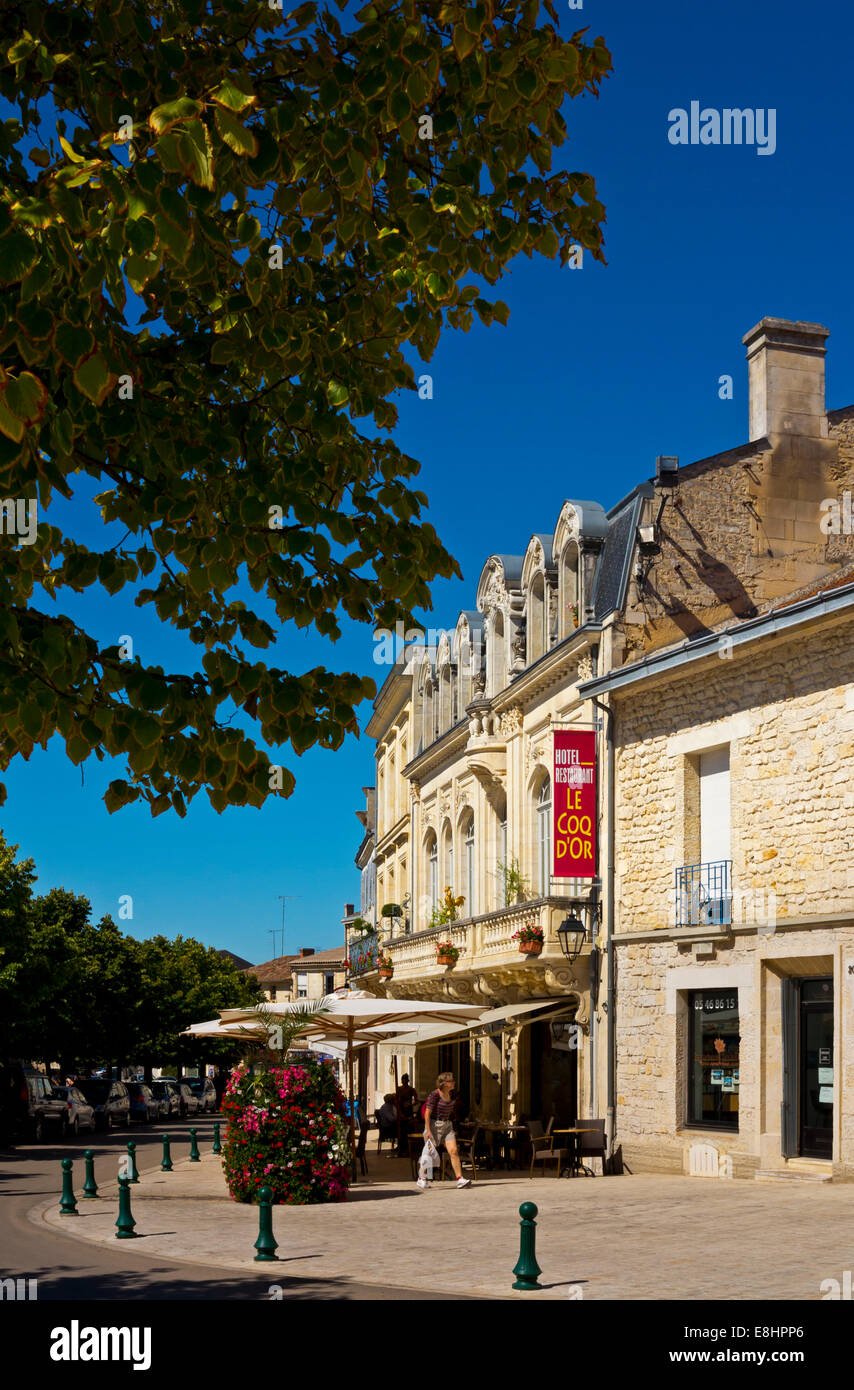 Traditional old buildings in summer in the town centre at Jonzac in the ...