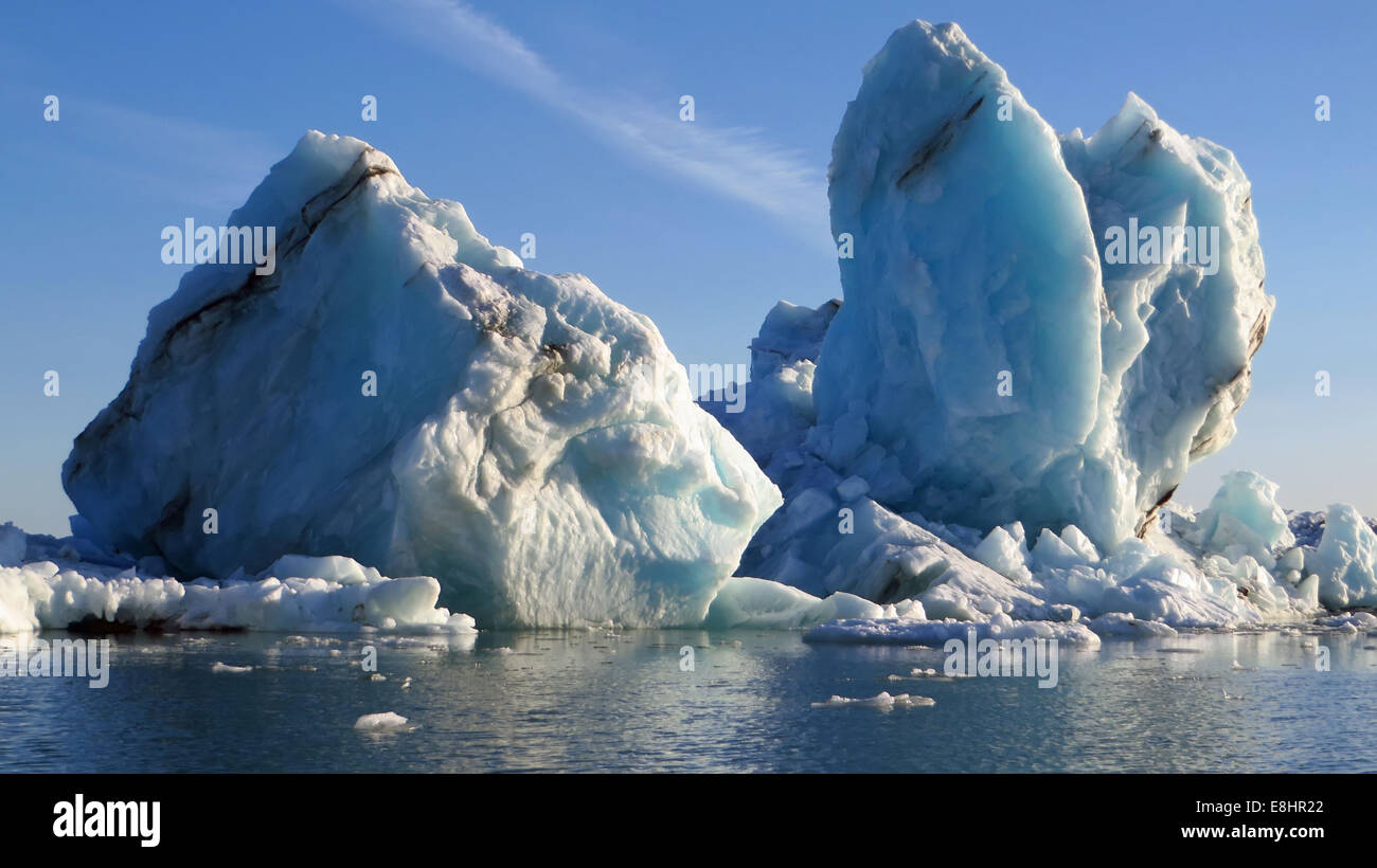 iceberg floating close to a glacier in Iceland Stock Photo - Alamy
