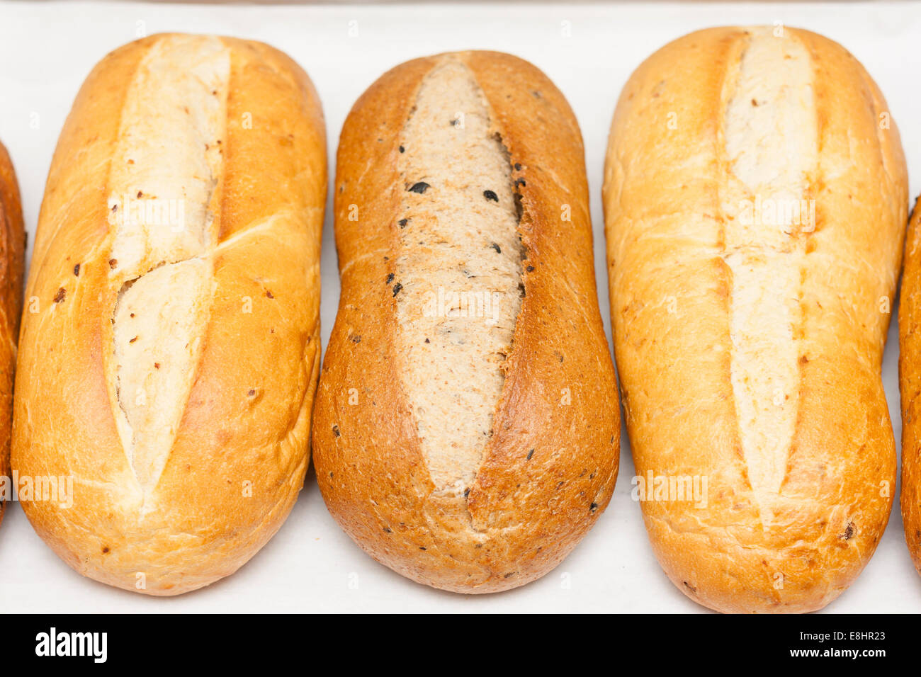 Close-up of three loaf of bread on white background Stock Photo - Alamy