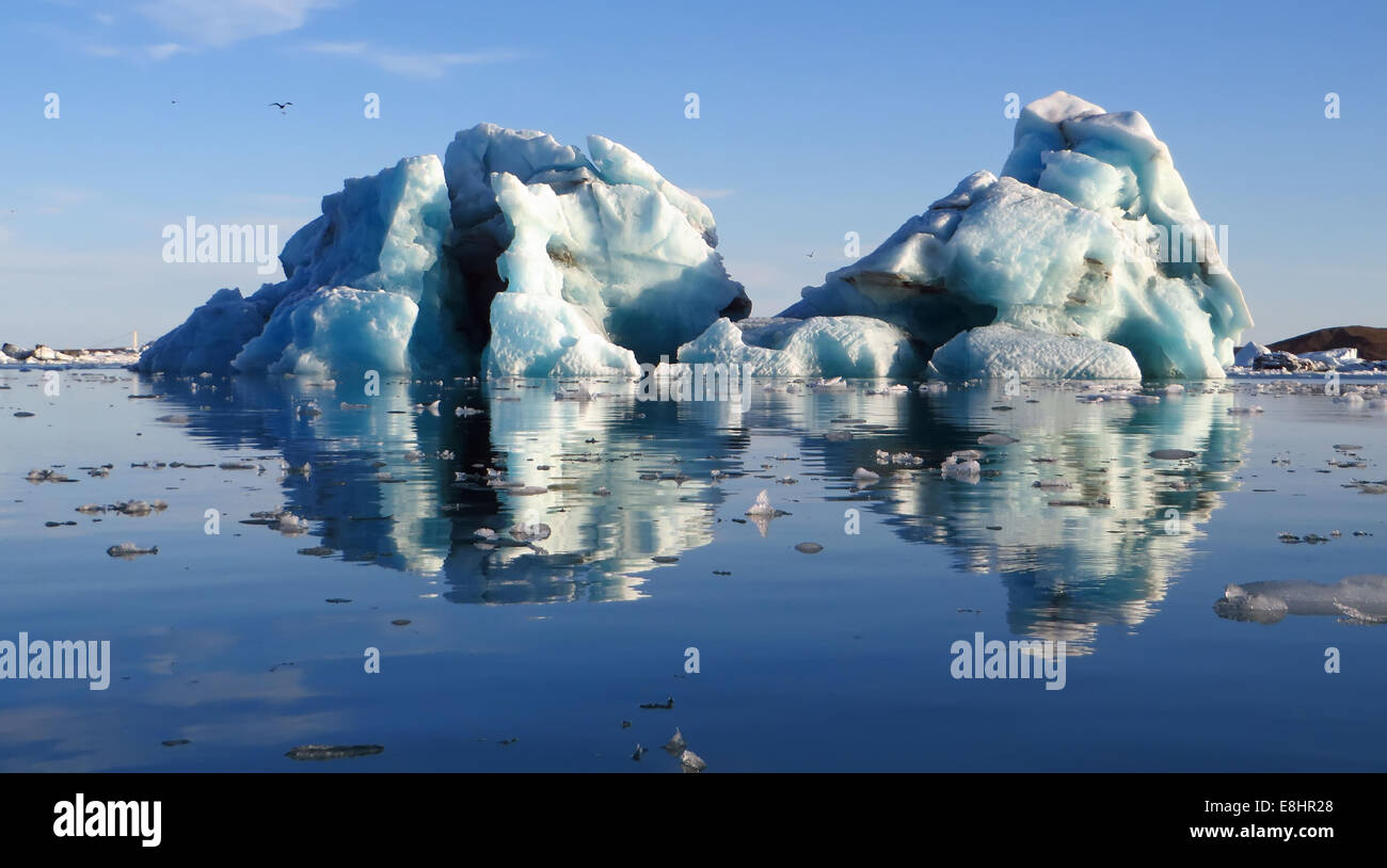 iceberg floating close to a glacier in Iceland Stock Photo - Alamy