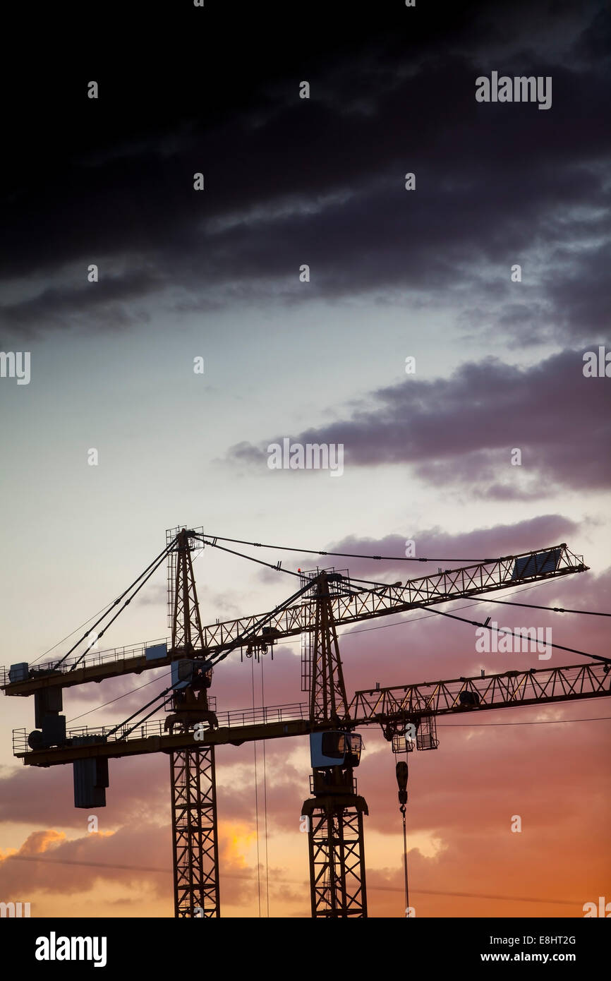 Color picture of some cranes on a construction site, as dusk Stock ...
