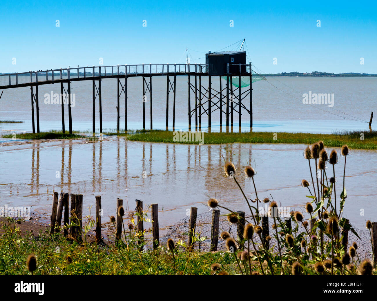 Wooden fishing hut on stilts at the Pôle-Nature de Vitrezay nature ...
