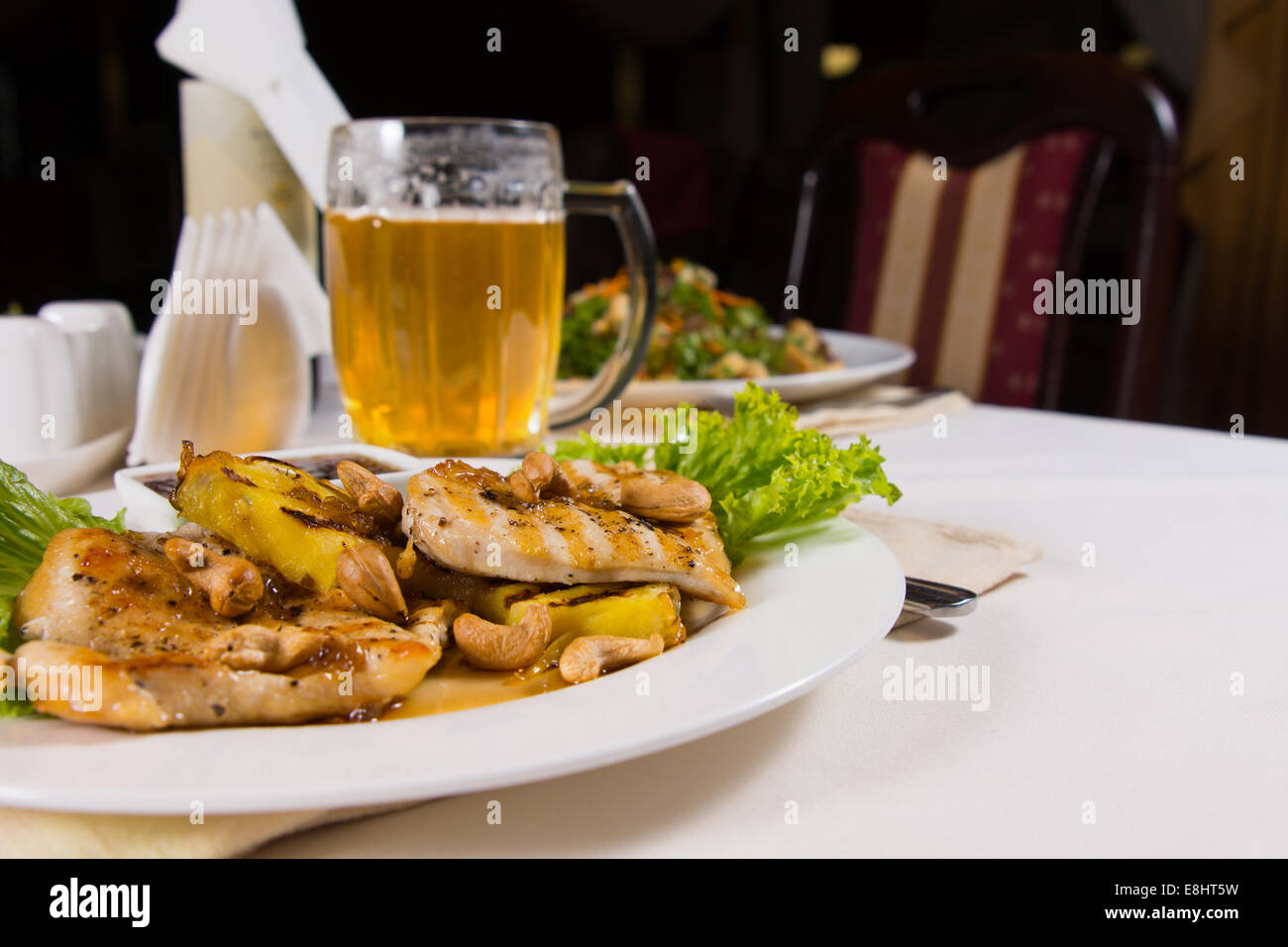 Appetizing Tender Juicy Chicken Meat Main Dish and a Mug of Beer Served ...