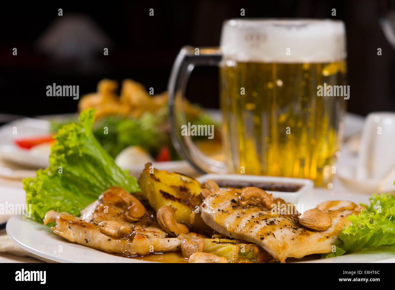 Appetizing Meaty Main Course with Dipping Sauce on Plate and Beer Mug ...