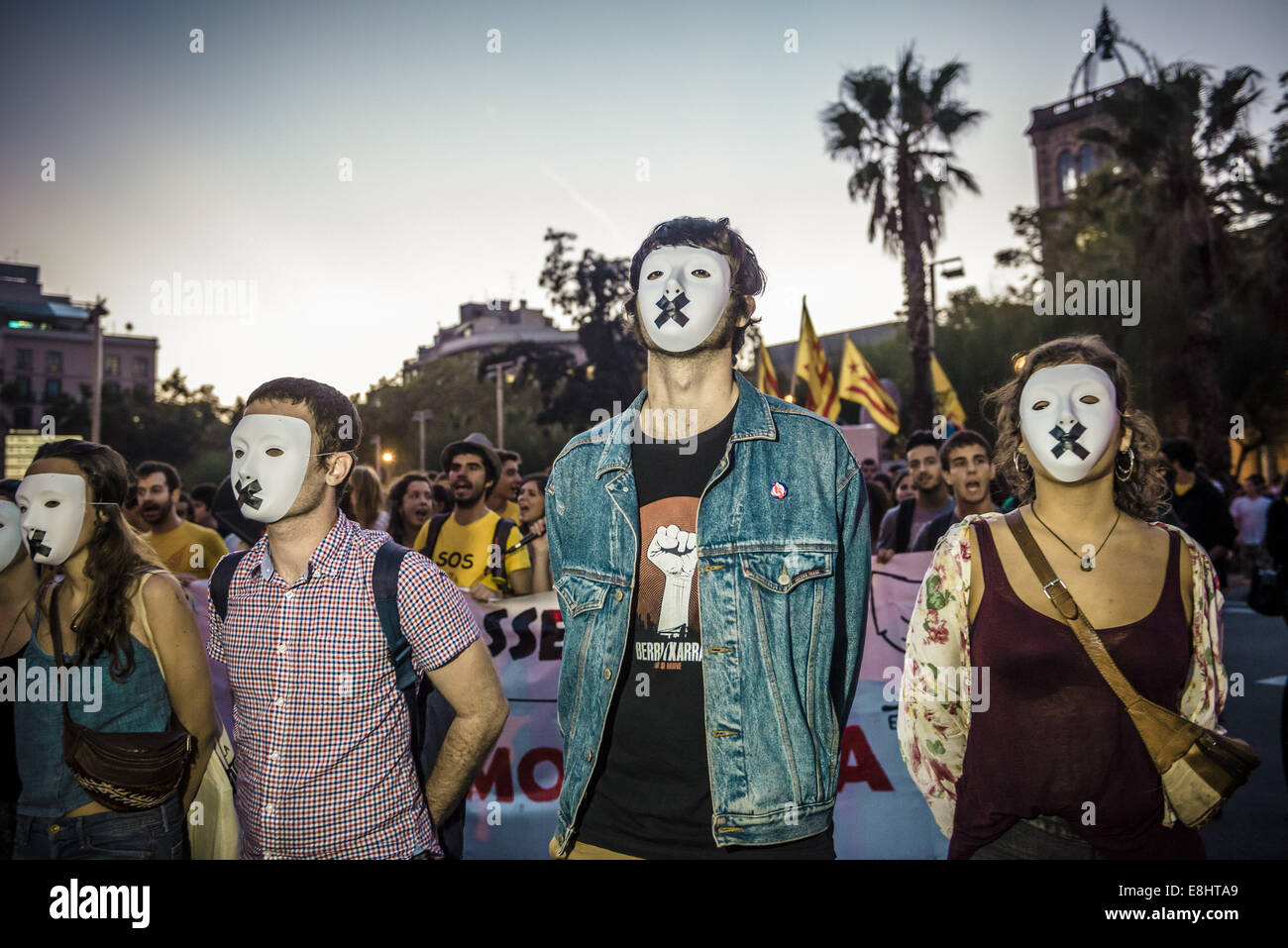 Barcelona, Spain. 8th October, 2014. Students wearing white face masks ...