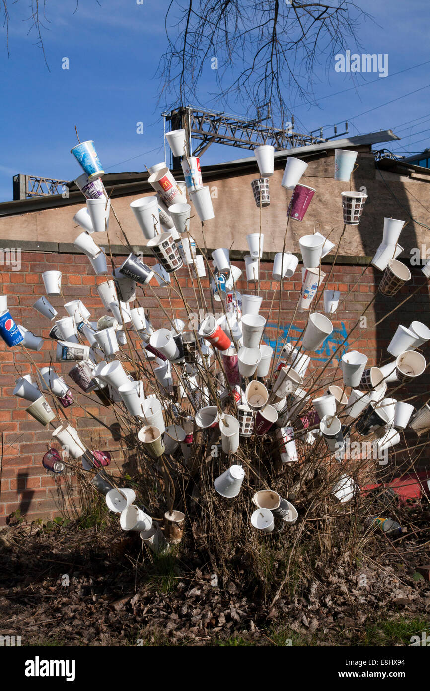 Litter Bush in Manchester, adorned with Polystyrene white cups, an ...