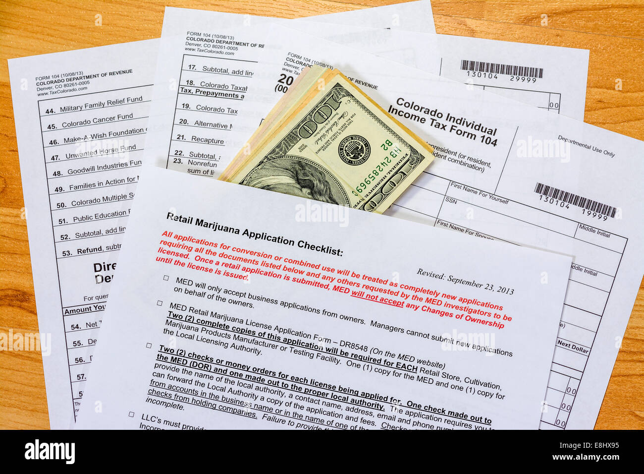 Colorado marijuana tax forms and money Stock Photo - Alamy