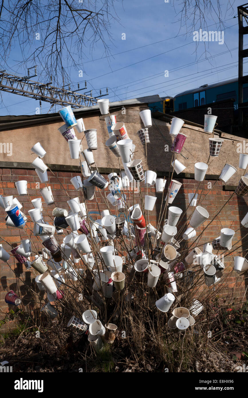 Litter Bush in Manchester, UK, adorned with Polystyrene white cups, an ...