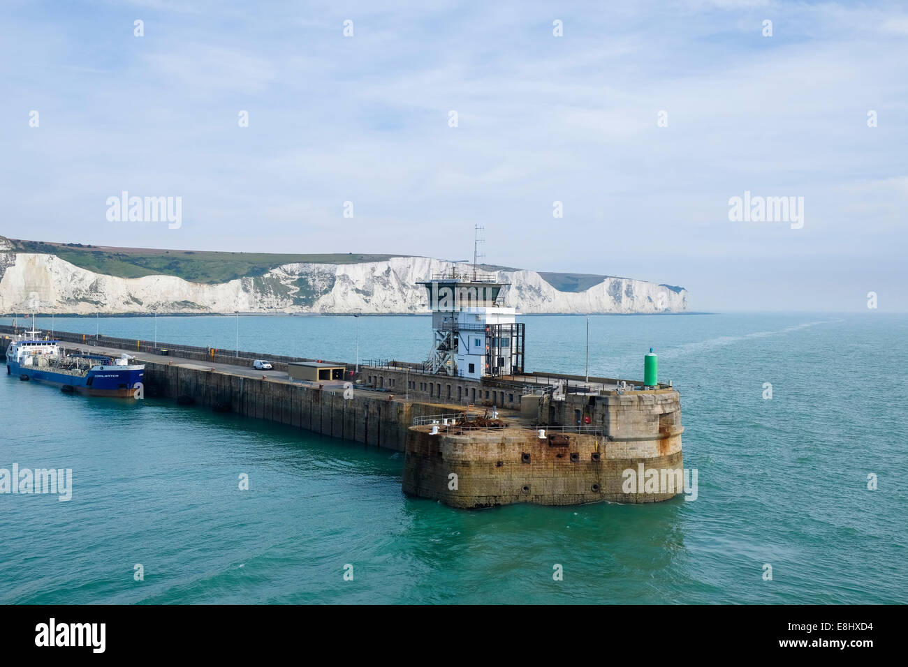 Port of Dover control tower on the harbour breakwater with white cliffs ...