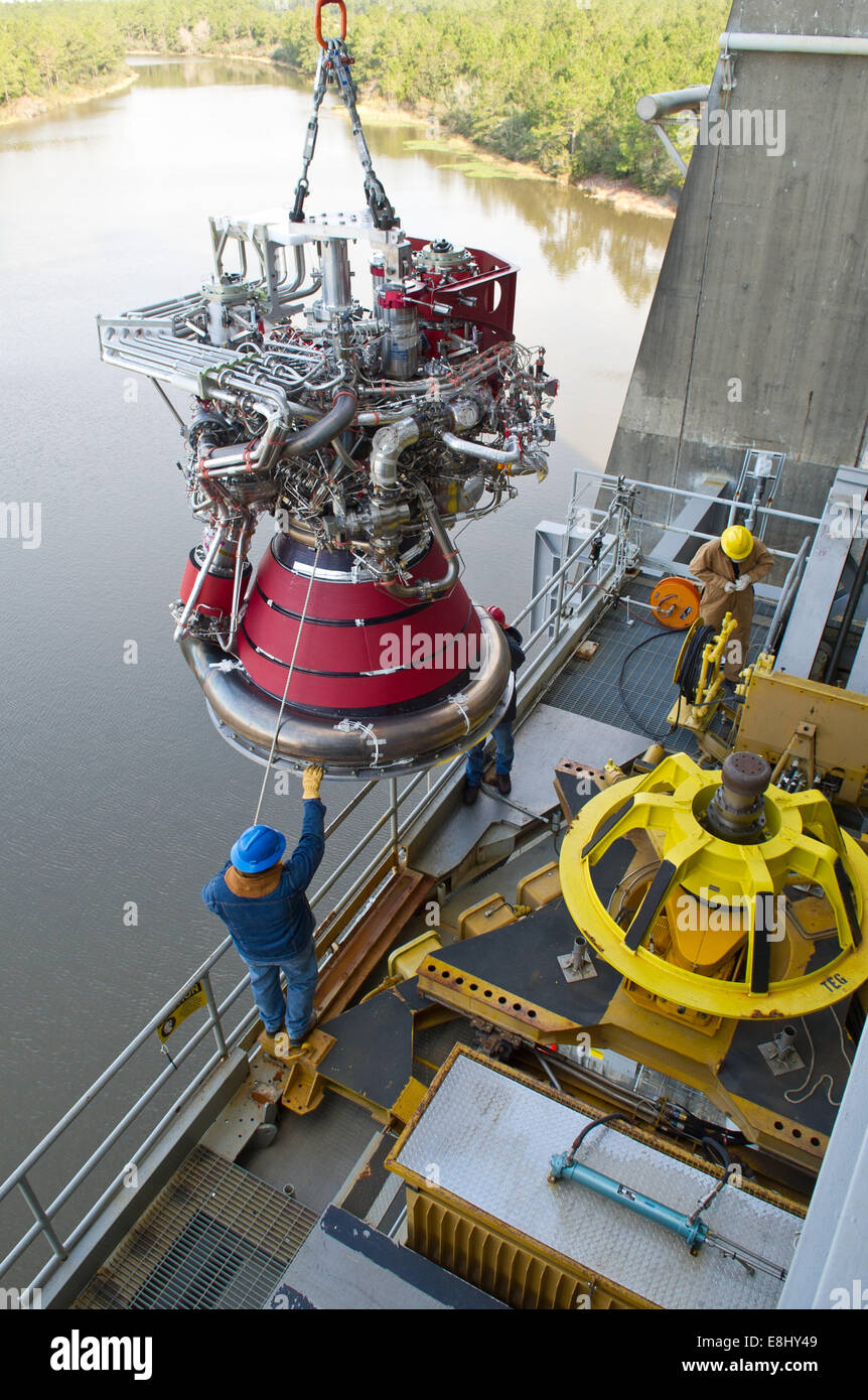 Engineers at NASA's Stennis Space Center in Mississippi hoist the J-2X ...