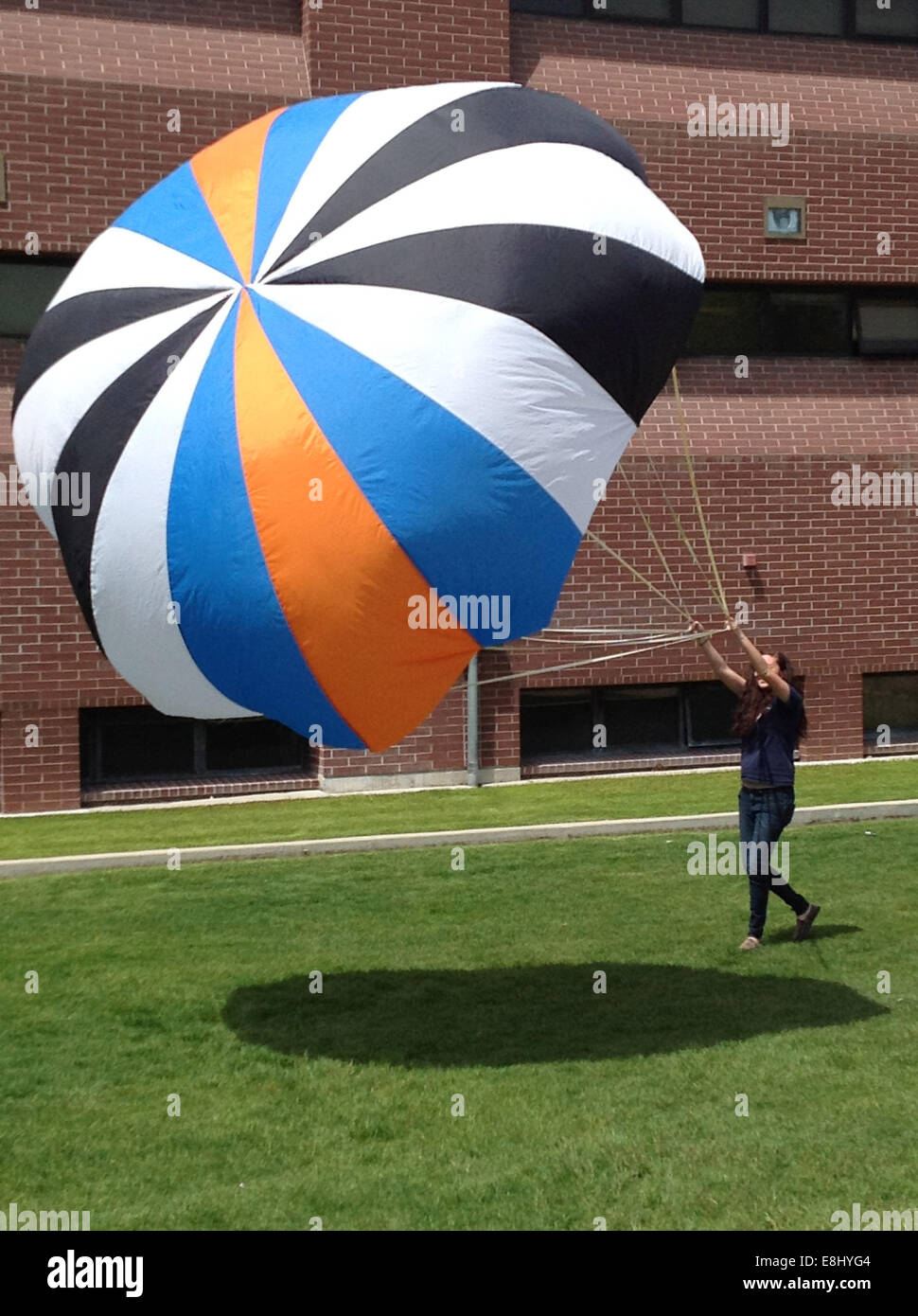 A student examines a parachute during the NASA Student Launch rocketry ...