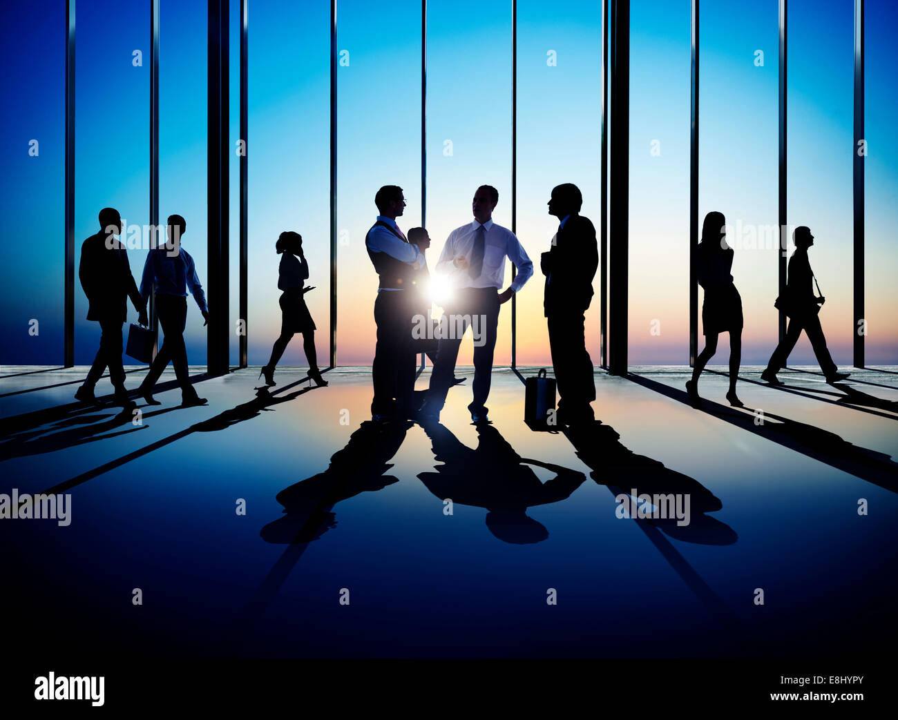 Group of busy business people in the building interior Stock Photo - Alamy