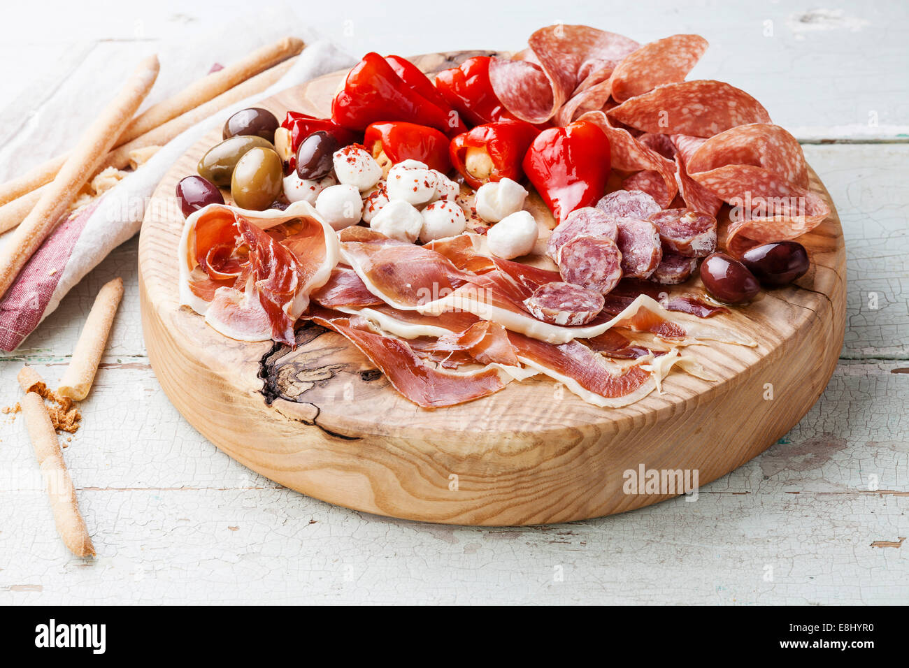 Cold meat plate and grissini bread sticks on wooden background Stock ...