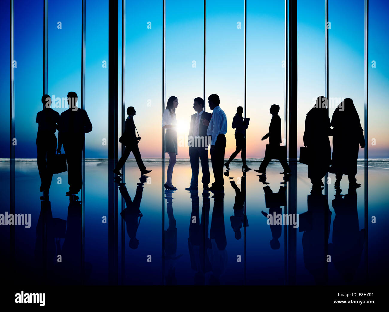 Group of busy business people in the building interior Stock Photo - Alamy