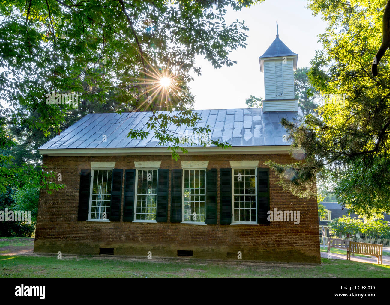 Brick church with windows and benches Stock Photo - Alamy