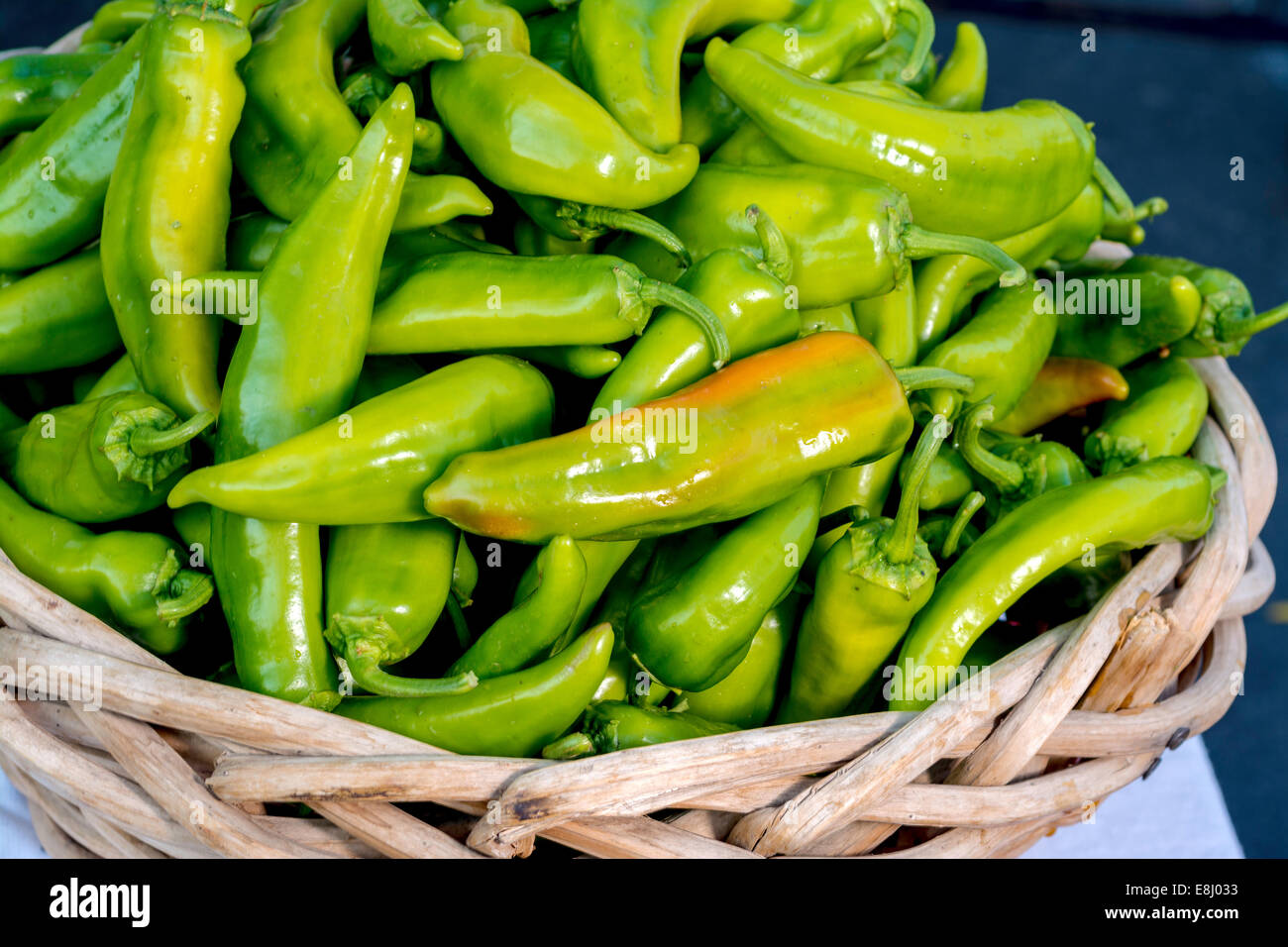 Green peppers in a basket Stock Photo - Alamy