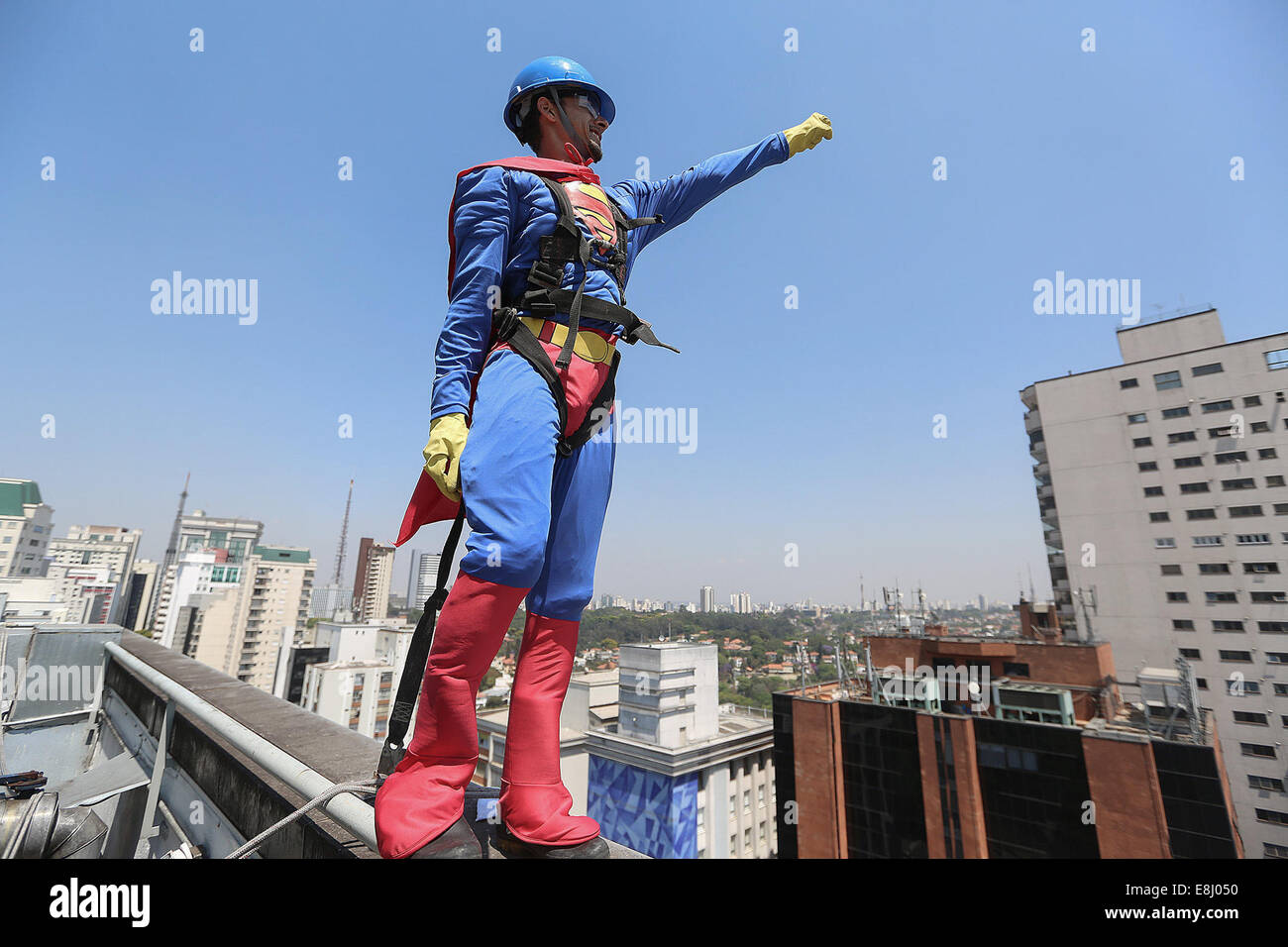Sao Paulo, Brazil. 8th Oct, 2014. A window cleaner dressed as Superman ...