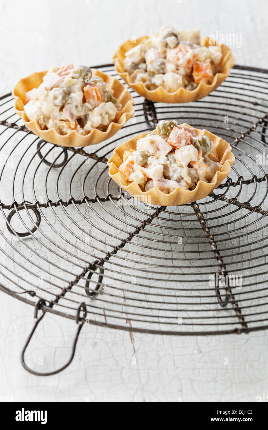 Russian traditional salad olivier in portioned baskets tapas buffet on ...