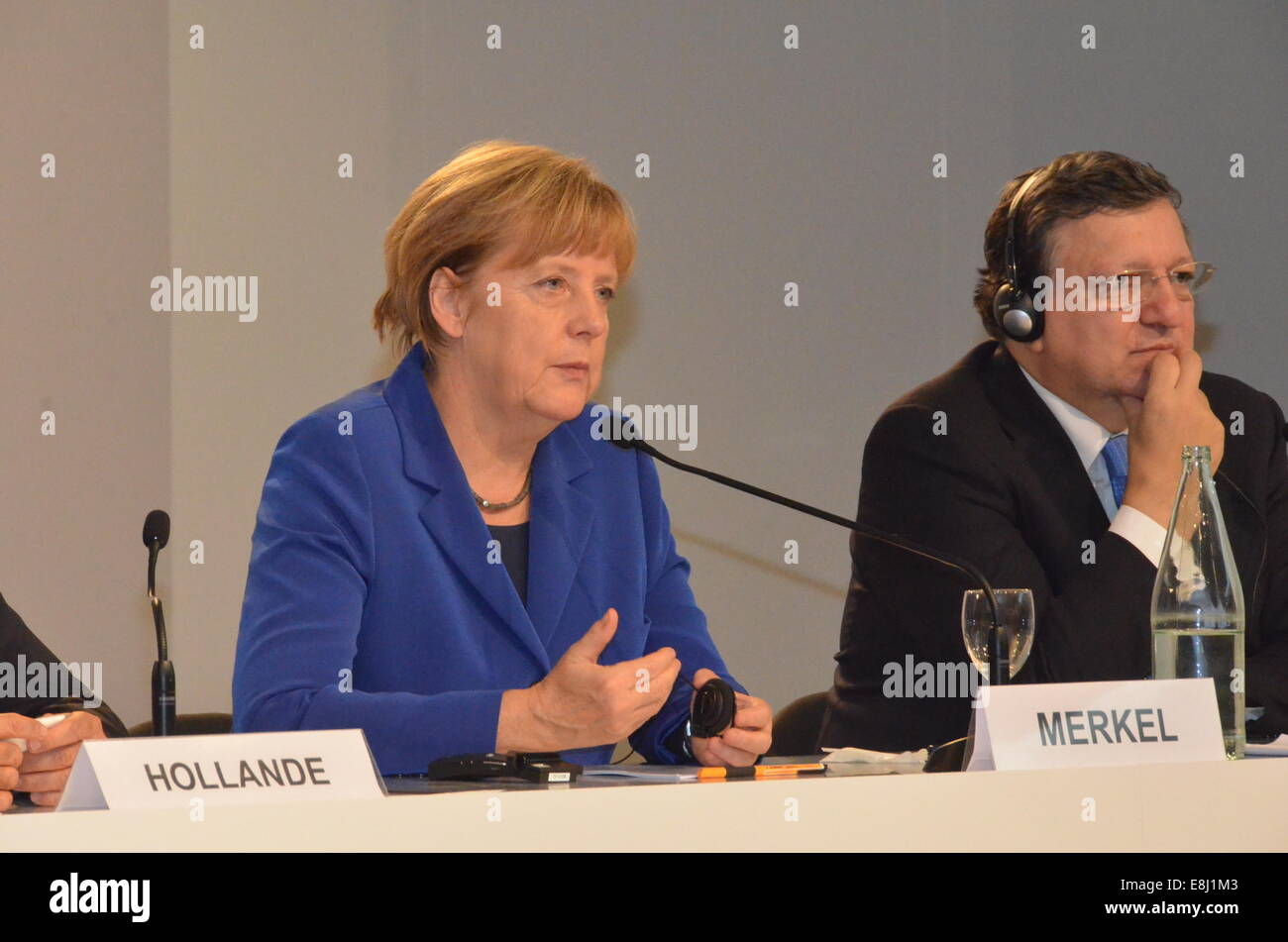 Milan, Italy. 8th Oct, 2014. German Chancellor Angela Merkel (L) speaks ...