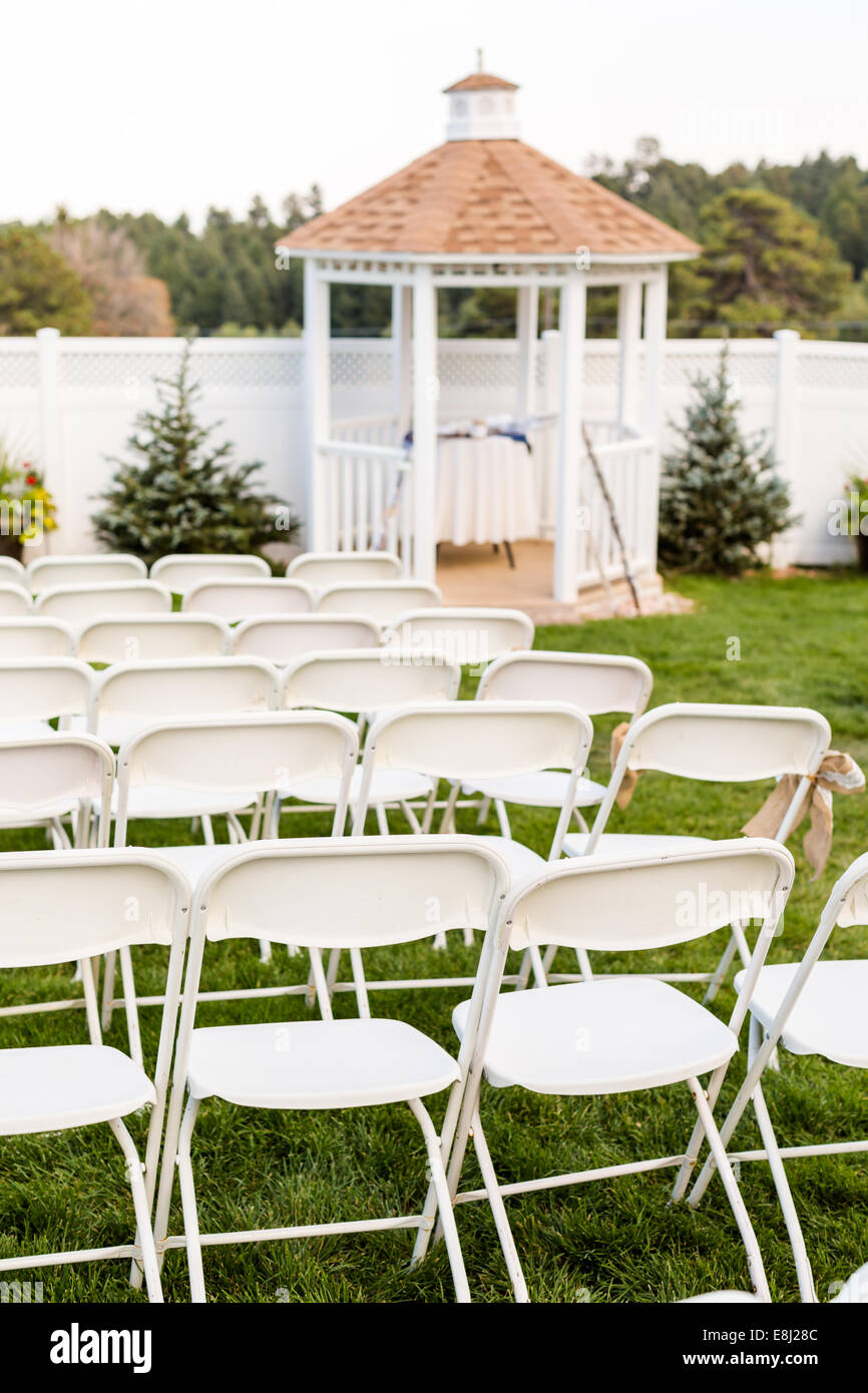 Empty white chairs before wedding ceremony Stock Photo - Alamy