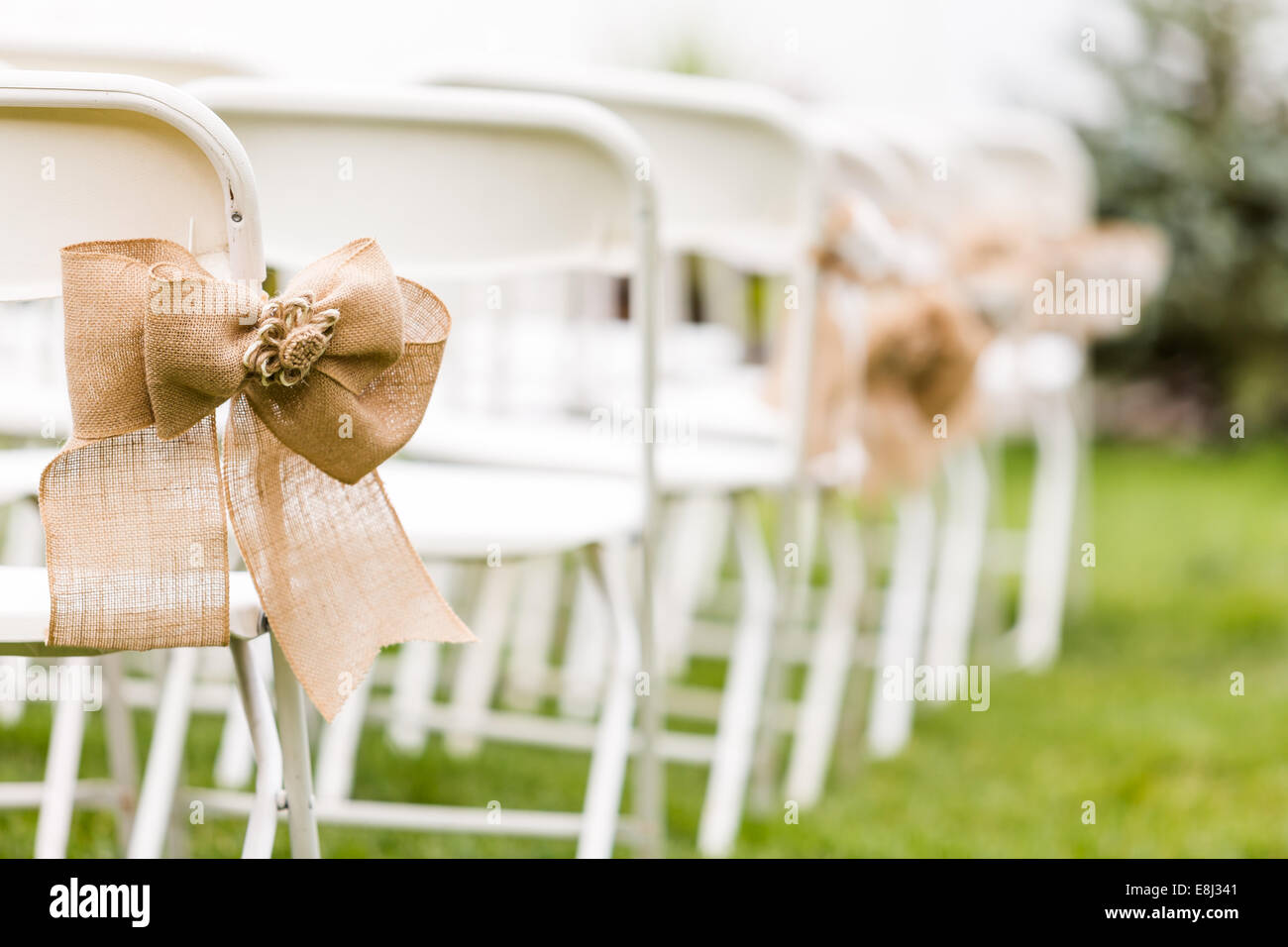 Empty white chairs before wedding ceremony Stock Photo - Alamy