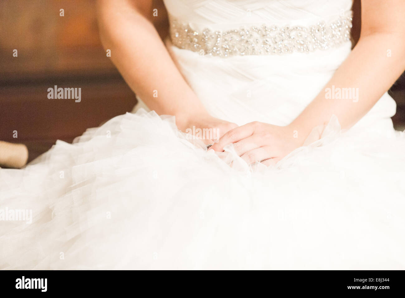 Bride sitting down before her wedding ceremony Stock Photo - Alamy