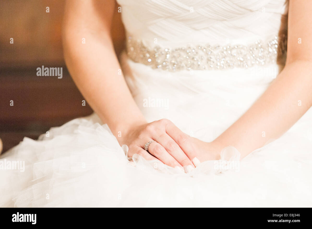 Bride sitting down before her wedding ceremony Stock Photo - Alamy