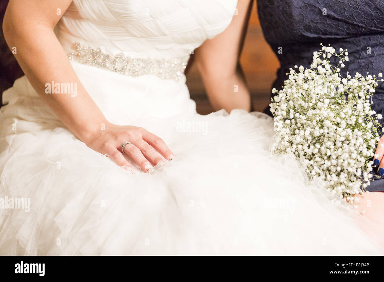 Bride sitting down before her wedding ceremony Stock Photo - Alamy