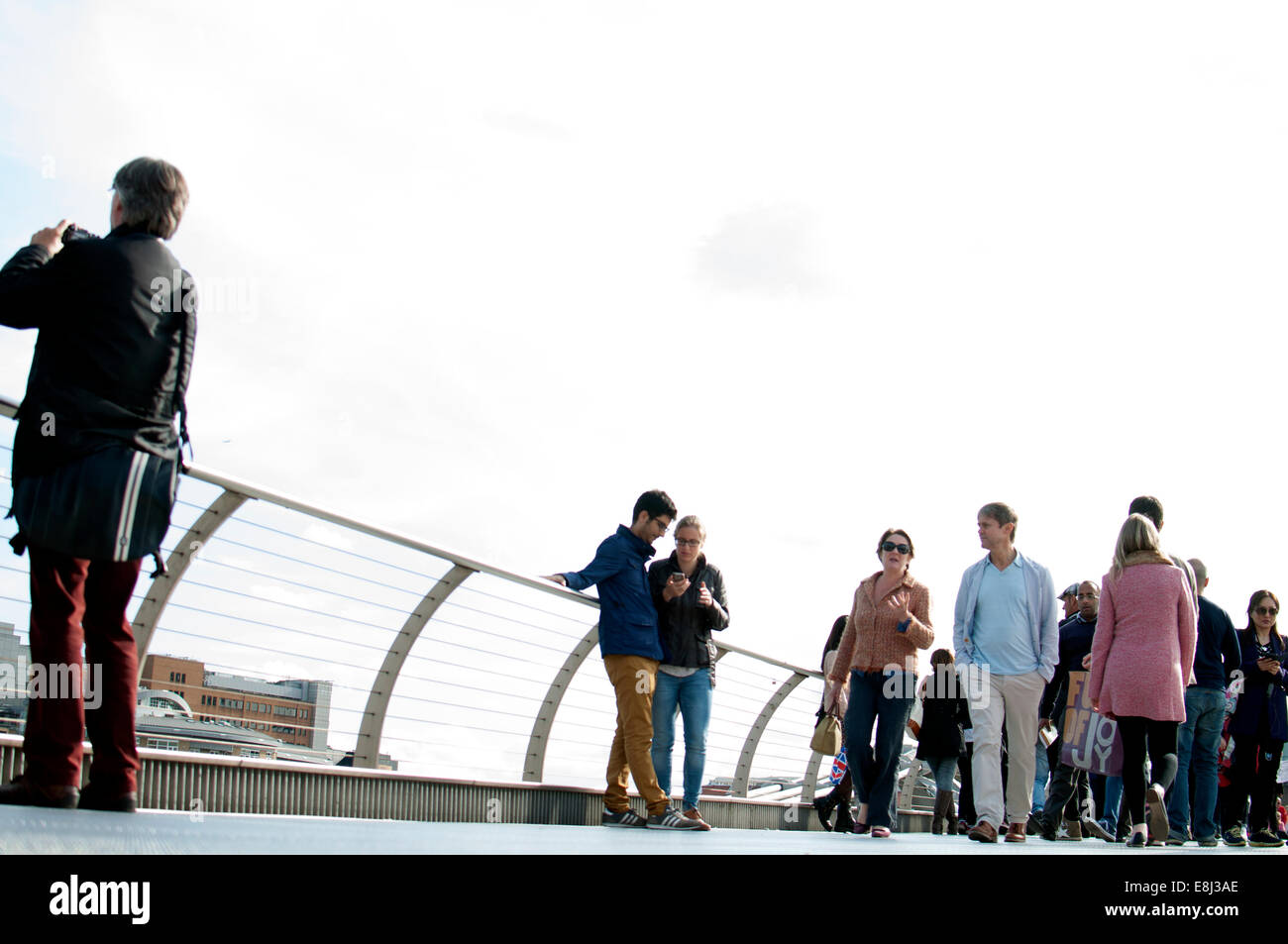 People on the Millennium Bridge, London, UK Stock Photo - Alamy