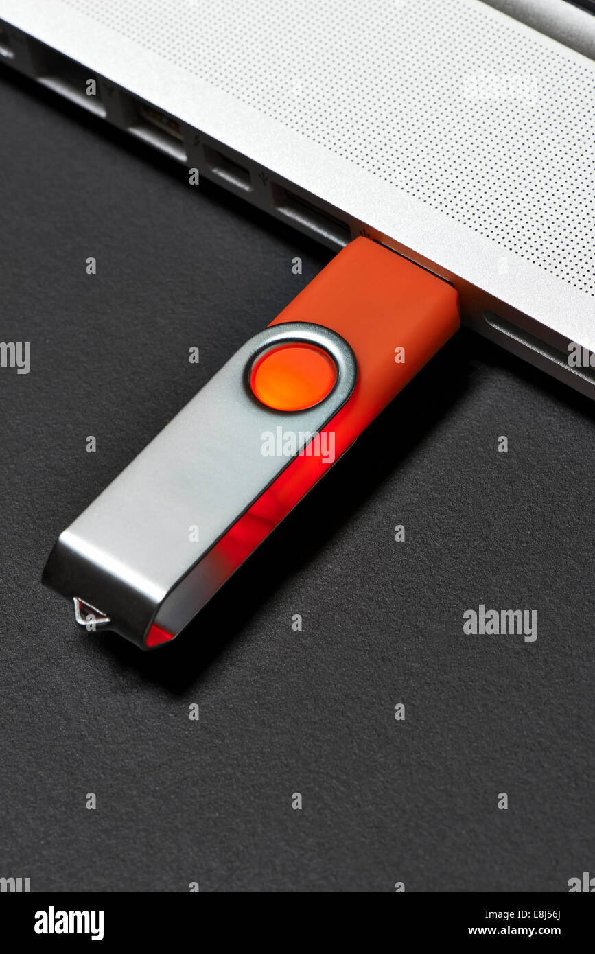 Flash memory drive plugged into a laptop port Stock Photo - Alamy