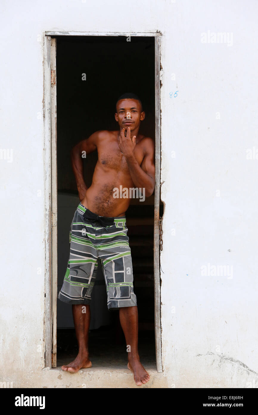 Man on his doorstep in a working class neighborhood in Salvador Stock ...