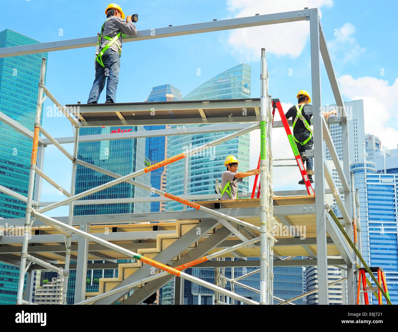 Workers at construction site in front of Singapore downtown in ...