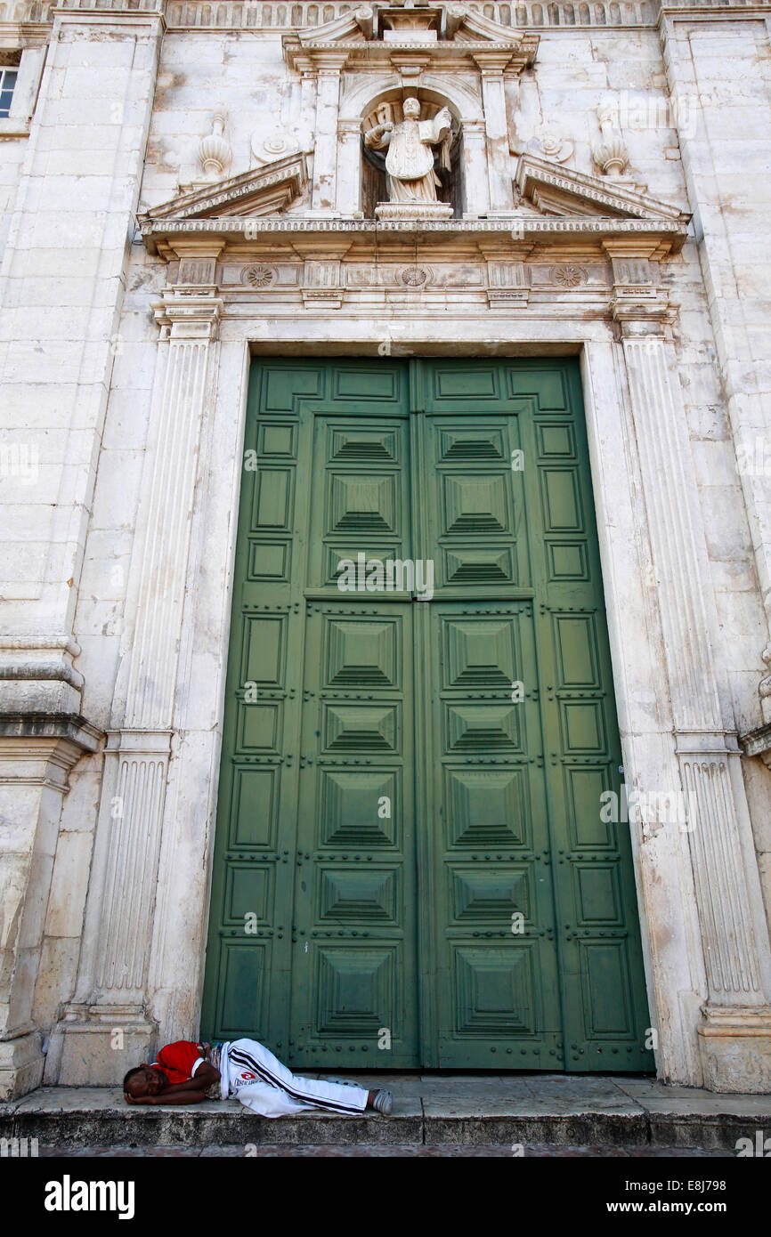 Man sleeping outside Salvador cathedral basilica Stock Photo - Alamy