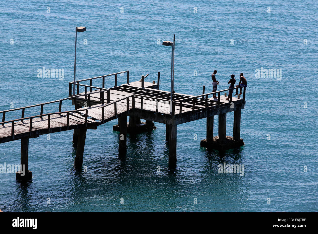 Young men on a pier Stock Photo - Alamy