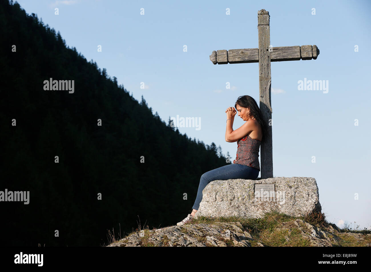 Woman Praying At The Cross