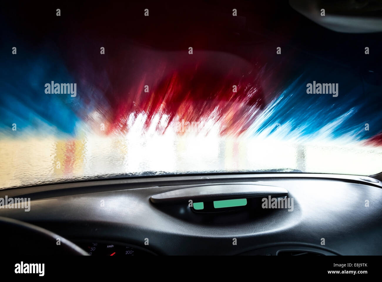 Motion blurred picture of car wash from inside a car during the wash ...
