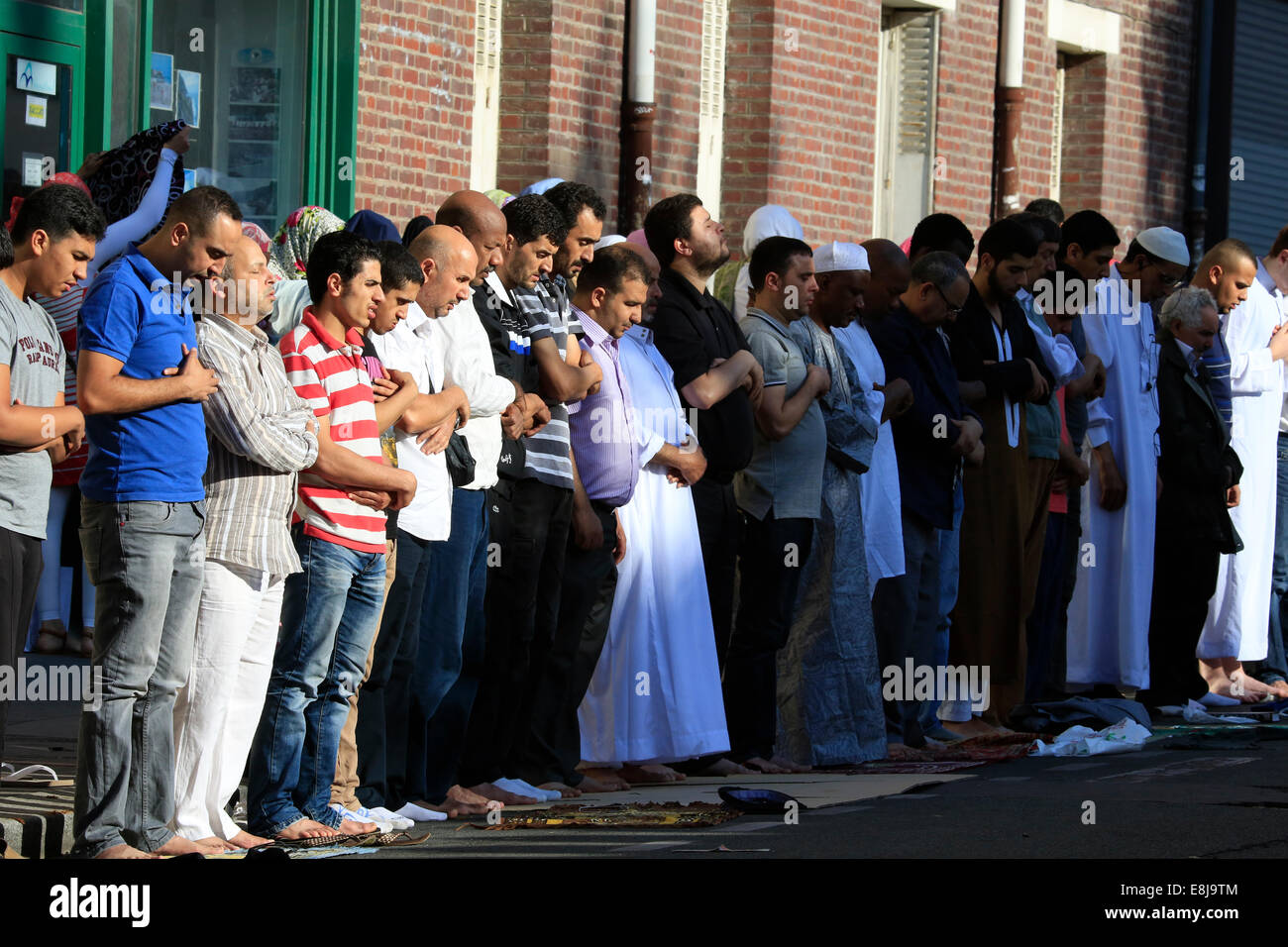 Muslims praying outside the Paris Great Mosque on A•d El-Fitr festival ...