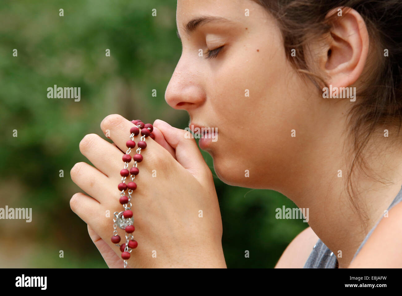 Teenager girl praying hi-res stock photography and images - Alamy