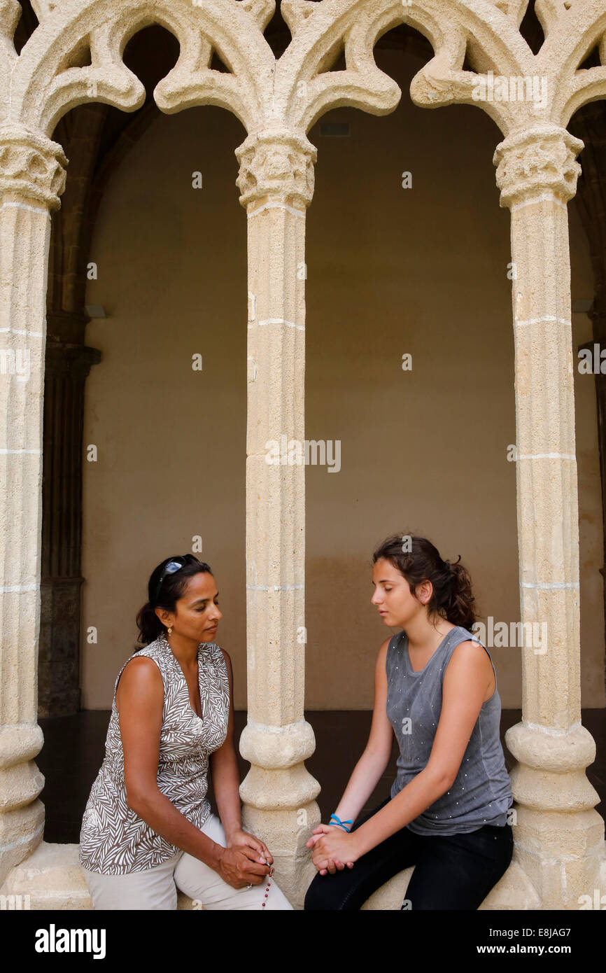 Mother and daughter praying Stock Photo - Alamy