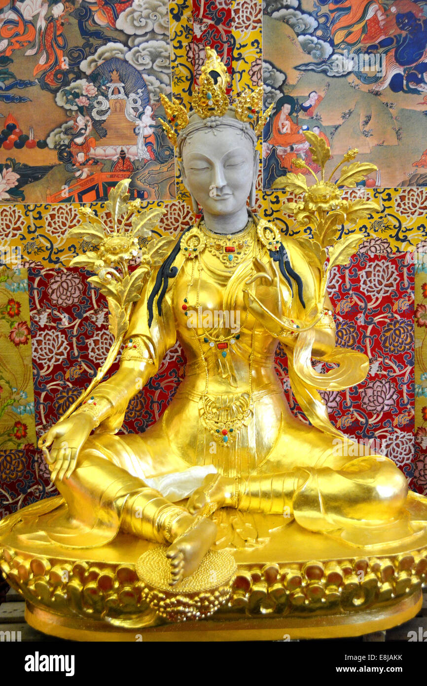 White Tara statue in Lerab Ling buddhist monastery Stock Photo - Alamy
