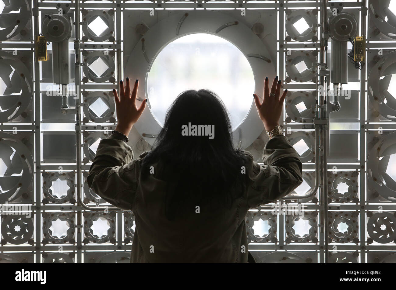 Woman in front a window Stock Photo - Alamy