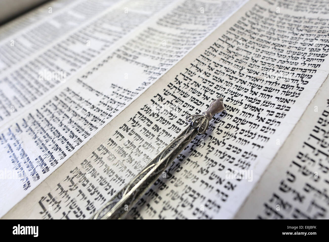 Jewish torah scroll with pointer Stock Photo - Alamy