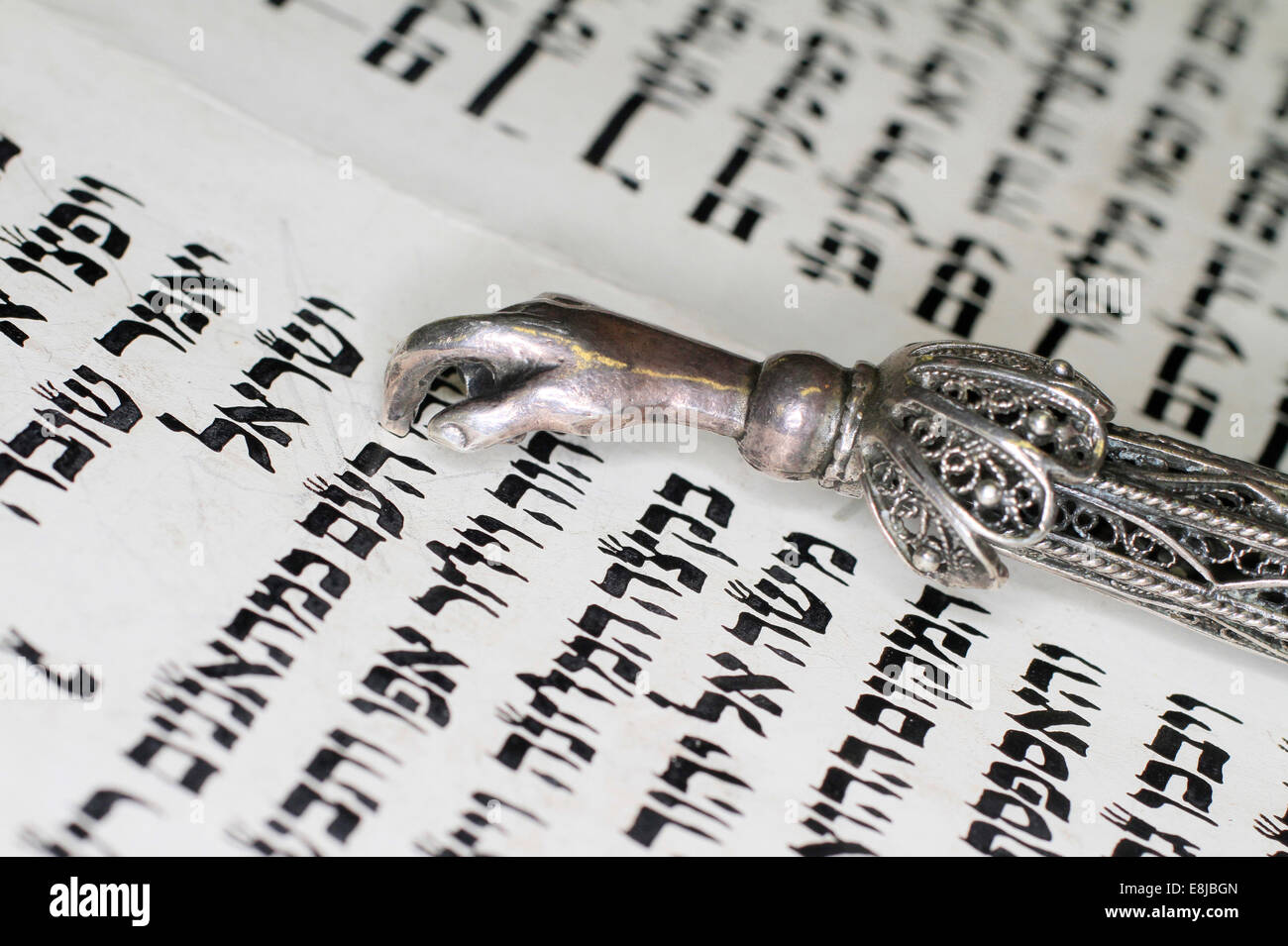 Jewish torah scroll with pointer Stock Photo - Alamy