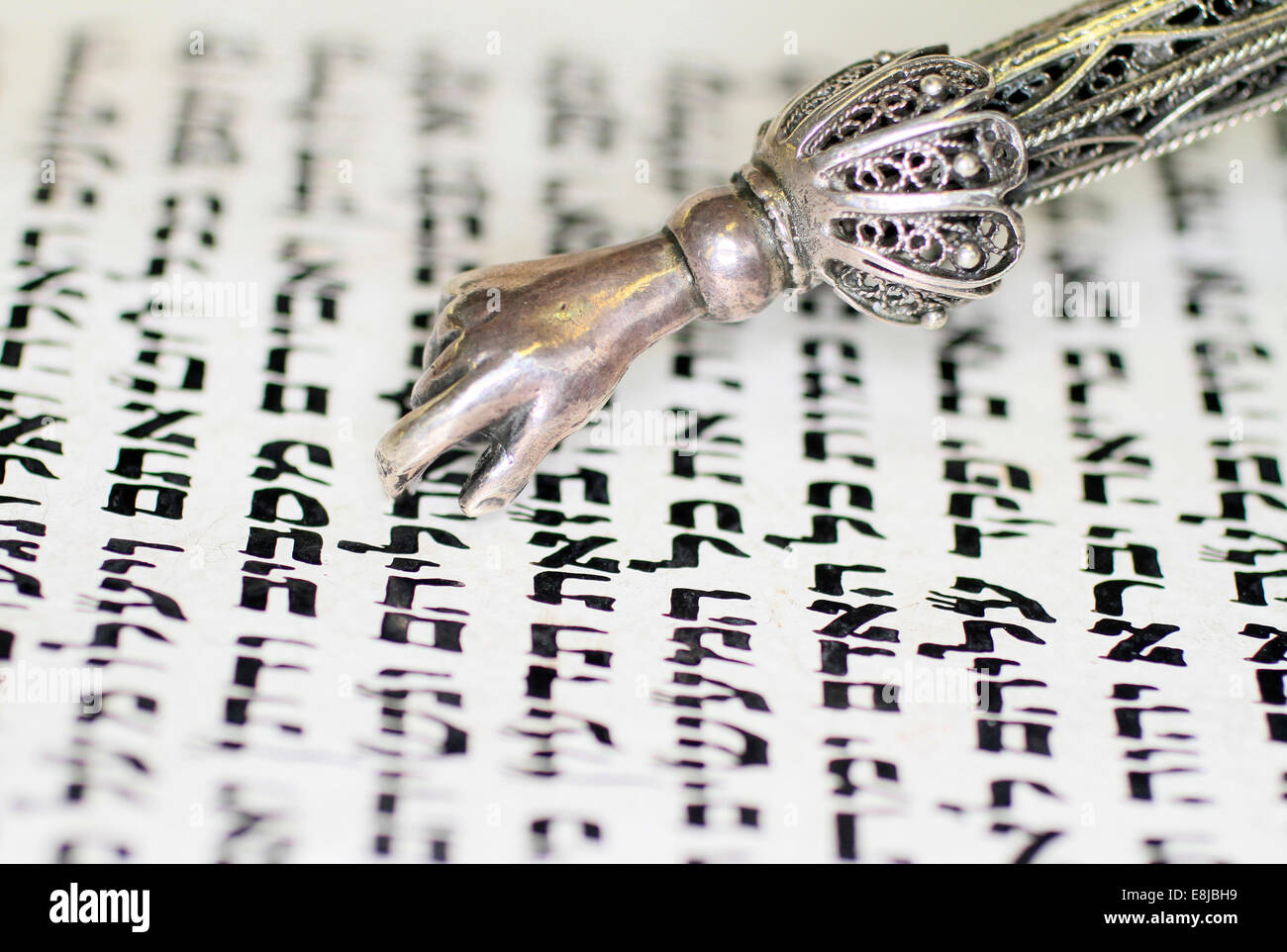 Jewish torah scroll with pointer Stock Photo - Alamy