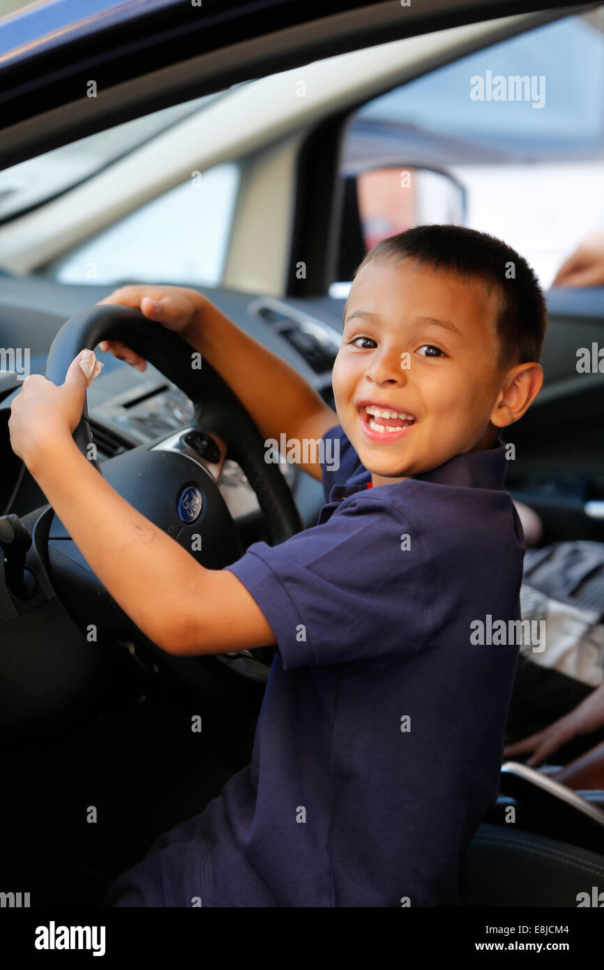 Boy pretending to drive a car Stock Photo - Alamy