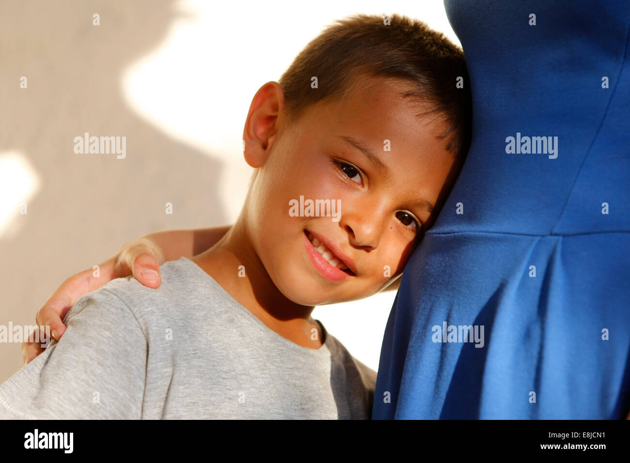 Brother and sister cuddling Stock Photo - Alamy
