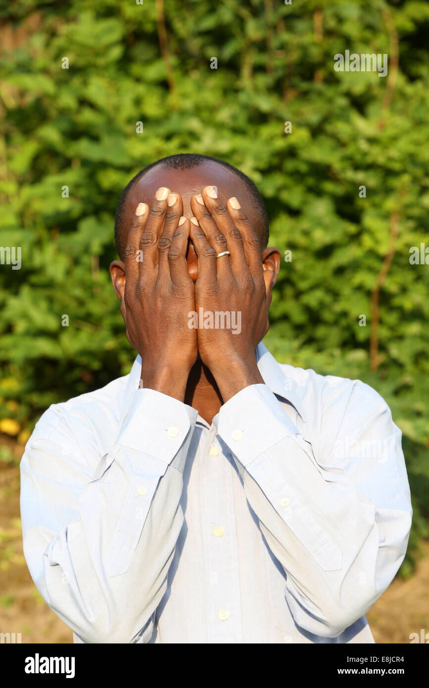 Man hiding his face Stock Photo - Alamy
