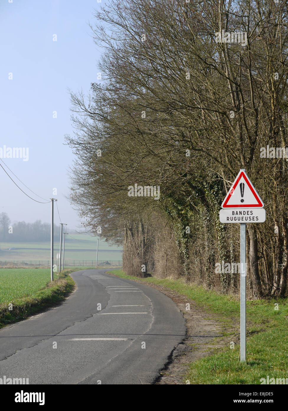 Traffic sign warning of the presence of "Rumble strips" on a country ...
