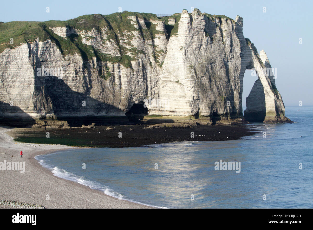 Downstream of the cliff and the Needle. View of the beach of Etretat ...